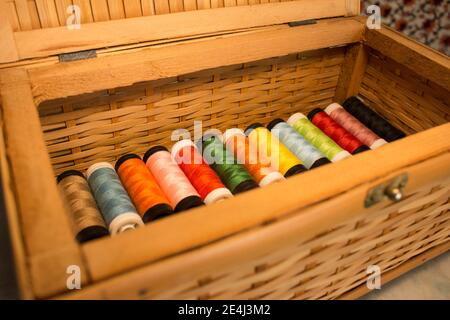 Wooden box full of thread spools multicolored [Black and White version ...