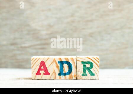 Letter block in word ADR Abbreviation of adverse drug reaction on wood ...