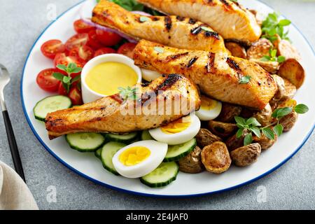 boiled eggs with vegetables in black bowl Stock Photo - Alamy