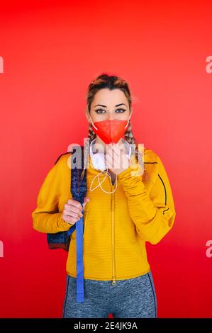 Young Hispanic female with red braids posing in a park Stock Photo - Alamy
