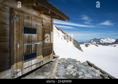 Buildings at the Mönchsjoch Hut under the Mönch mountain in the Bernese ...