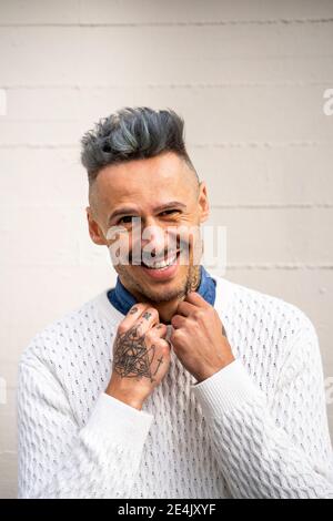 Image of stylish handsome man in black suit, cringe from something ...