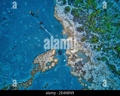 Aerial of fisherman walking on lake Tengiz, Korgalzhyn Nature Reserve ...