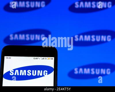 In this photo illustration a Samsung logo seen displayed on a ...