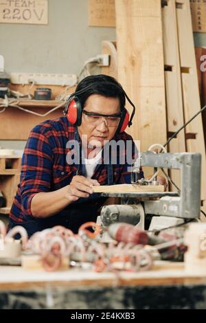 carpenter cutting a wooden board Stock Photo - Alamy