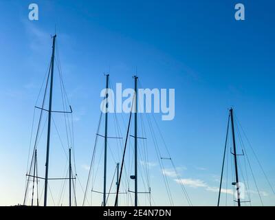 An aerial shot of yacht masts under blue sky Stock Photo - Alamy