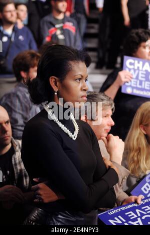 Michelle Obama listens to her husband Barack obama during a primary ...