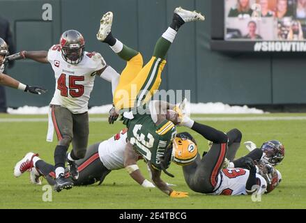 Green Bay Packers' Jamaal Williams (30) is tackled by Atlanta Falcons ...