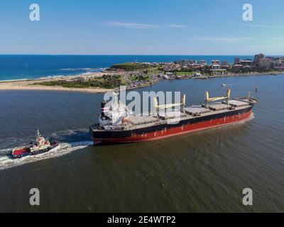 A large coal transport ship entering Newcastle Harbour - Newcastle is ...