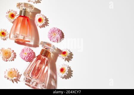 Bottle of fragrance surrounded by flower buds Stock Photo - Alamy
