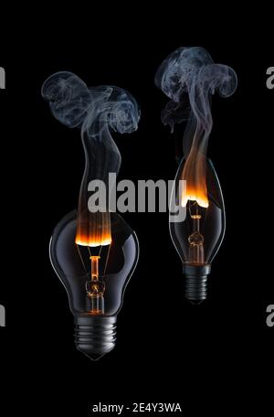 Collection of light bulbs with fire and smoke on black background Stock ...