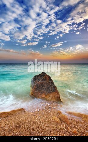 Clear sea and big stone in shape of eye. Wildlife Wunderlast Summer ...
