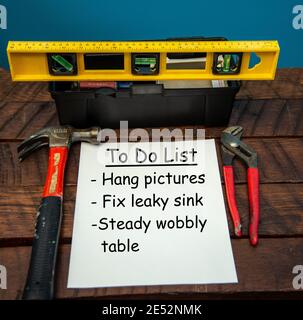 Toolbox with tools laid out on a table with white paper Stock Photo - Alamy