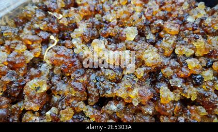 Natural resin secreted from the peach tree, forming amber-like crystals ...