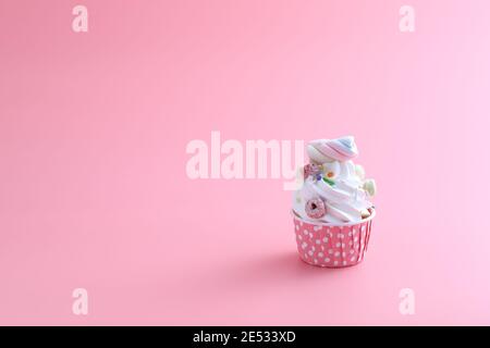 cupcake isolated in pink background Stock Photo - Alamy