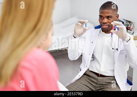 Image of nice african american girl listening music with earpods while ...