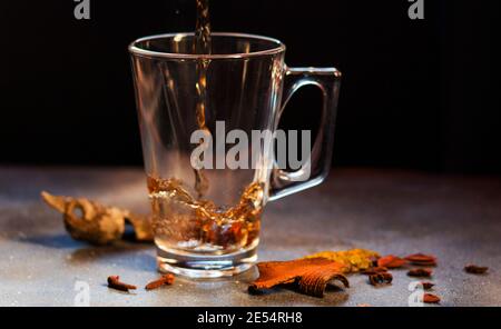 Rome with tea, Grog on the black background Stock Photo - Alamy