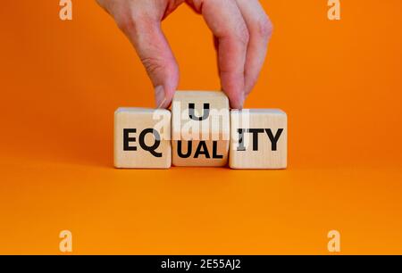 Equity and equality symbol. Businessman turns wooden cubes and changes ...