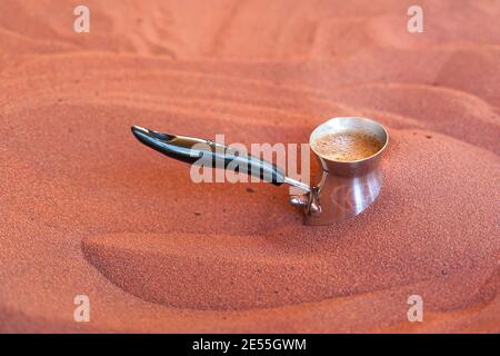 Traditional turkish coffee prepared on hot sand Stock Photo - Alamy