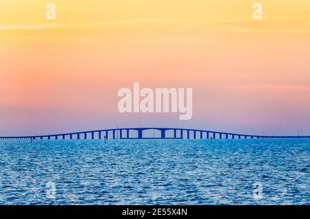 The Dauphin Island Bridge is pictured at sunset from Blue Heron Park ...