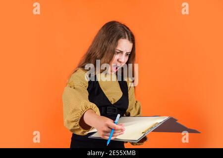 Amazed teenager. Back to school. Teenager school girl on isolated ...