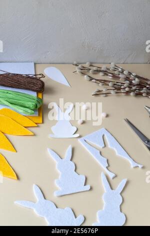 Funny handmade Easter rabbits on wooden table Stock Photo - Alamy