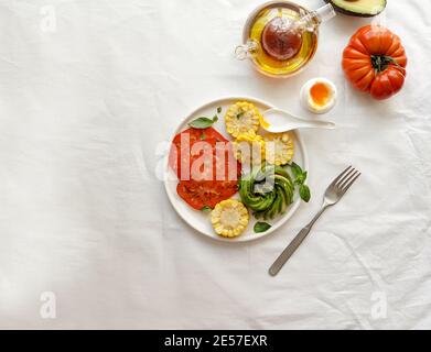 breakfast - tomatoes, avocado rose Stock Photo - Alamy