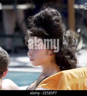 "Rehab" singer Amy Winehouse displayed her tattoos and scars in a ...