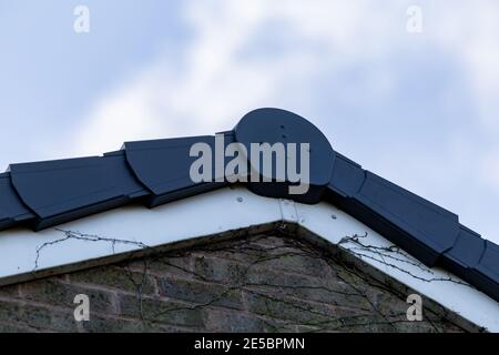 A dry verge roof system on the gable end of a house Stock Photo - Alamy