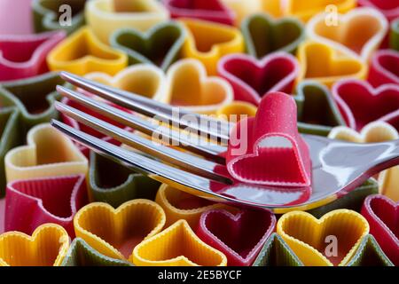 Cuoricini Italian pasta on a fork. romantic food background Stock Photo ...
