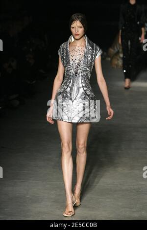 A model presents a creation by designer Alexander Mc Queen as part of ...