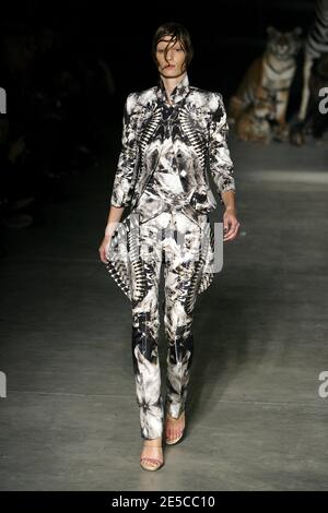 A model presents a creation by designer Alexander Mc Queen as part of ...