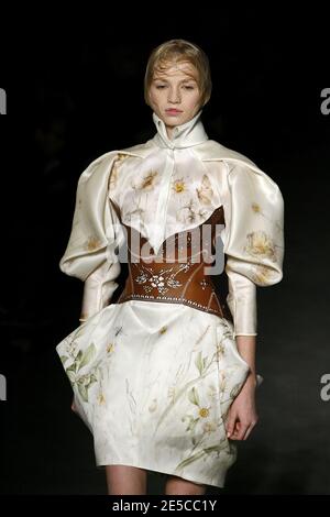 A model presents a creation by designer Alexander Mc Queen as part of ...