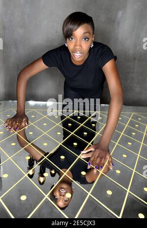 EXCLUSIVE. British singer Estelle poses inside Baccarat showroom in ...