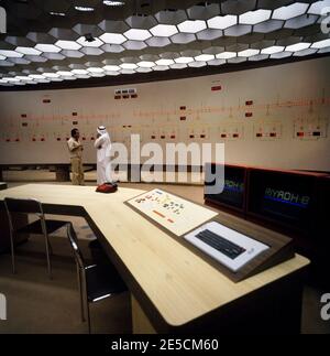 Control room workers at a gas turbine co-generation plant (natural gas ...
