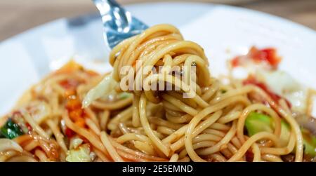Spaghetti cooked in Thai style, hot and spicy Stock Photo - Alamy