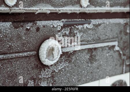 Winter scene of morning crystals fanning out across a metal mailbox and ...