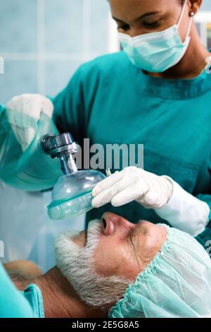 Anesthesiologist doctor anesthetized a surgical patient in hospital ...