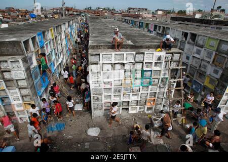 People visit their departed loved ones in observance of All Souls’ Day ...