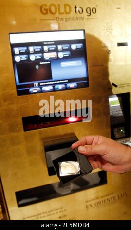 A gold bar ATM machine in Dubai Stock Photo - Alamy