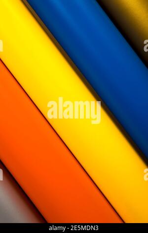 Colorful vinyl rolls on wooden background Stock Photo - Alamy