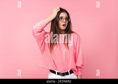 Photo of pretty minded young lady hand chin look empty space wear ...
