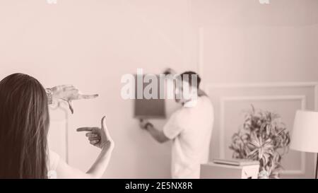 young couple arranging things in their new apartment Stock Photo - Alamy