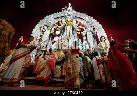 Devotees offer prayers to the Goddess Durga during the Durga Puja ...