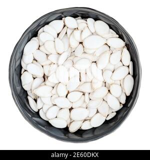 Unpeeled raw pumpkin seeds, macro, top view Stock Photo - Alamy
