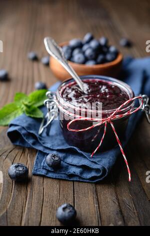 Blueberry antioxidants on a wooden table on a background of Norwegian ...