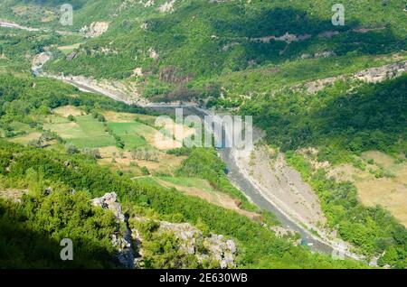 high view of the Valley Erzen River from footpath to the Pellumbas Cave ...