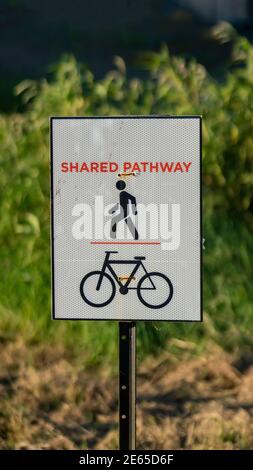 Road sign Shared Lane Bicycles and Pedestrians on sunny day Stock Photo ...
