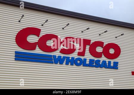 A logo sign outside of a Costco Business Center retail store in Hayward ...