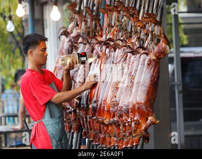 Man eating like a pig Stock Photo - Alamy
